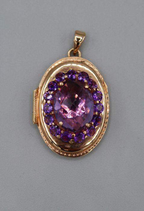 An Italian amethyst set locket in rose-pink metal. Stamped 750 with ...