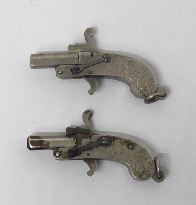 An unusual pair of miniature Berloque percussion pistols, likely of ...