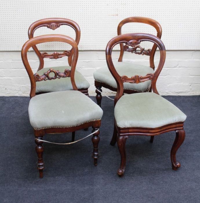 A matched set of four Victorian walnut spoon back dining chairs