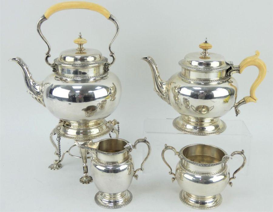 A heavy quality four piece Mappin & Webb silver tea service with spirit ...