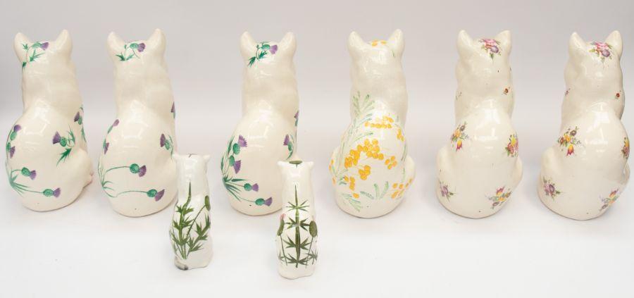 Wemyss Ware Plichta Cat Figures with glass and painted in eyes thistles ...