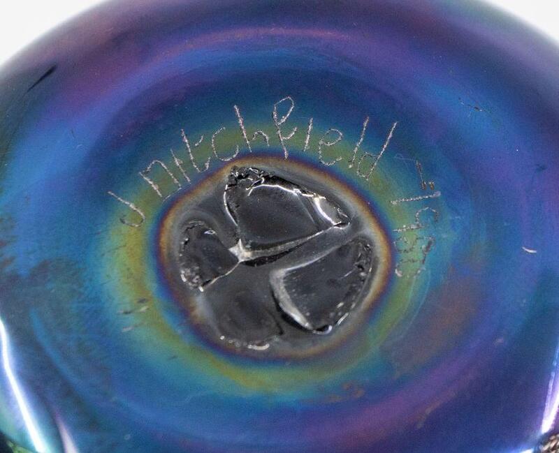Ditchfield Glass - A thin stemmed dark iridescent vase with cream ...