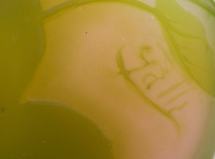 Galle - A small globular green ground glass vase, the body acid etched ...