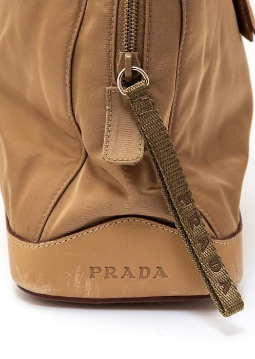Prada - a beige nylon Prada tote, trimmed in leather, two shoulder ...