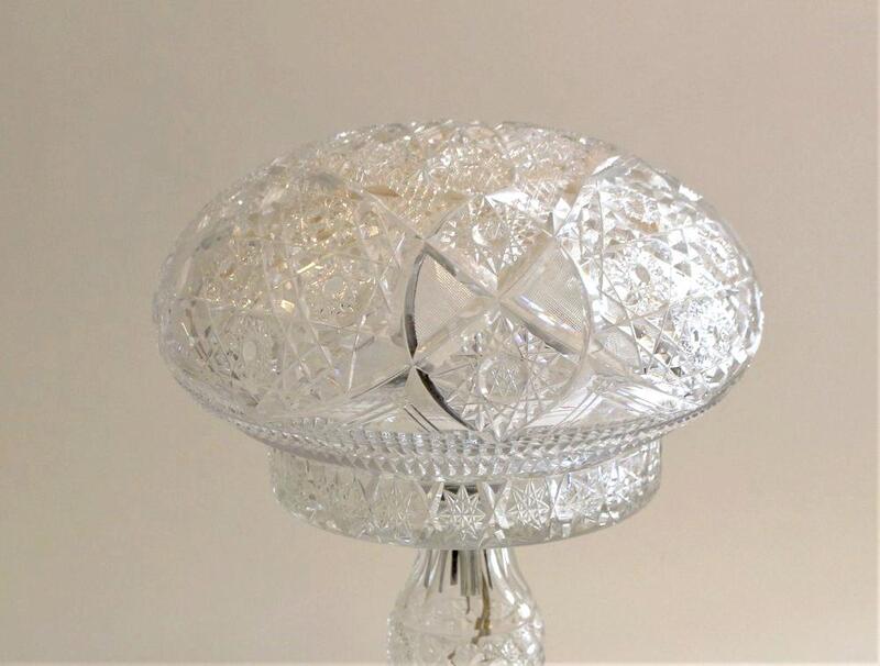 A cut glass table lamp of baluster shape with mushroom shaped shade ...