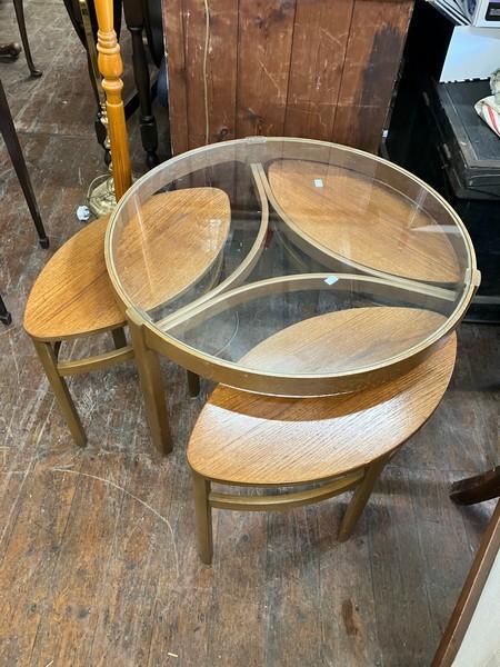 Nest of four tables , three teak elliptical tables under glass topped ...