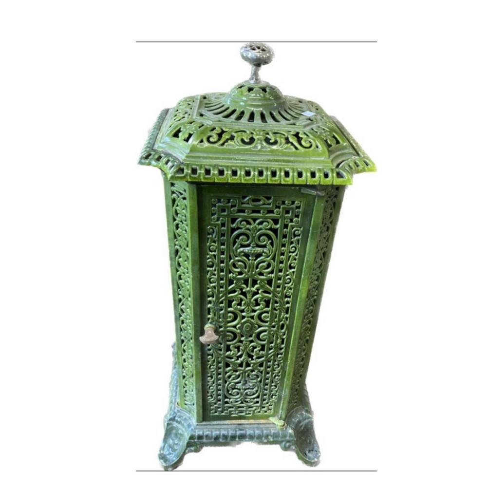 Green enamelled cast Iron Stove/heater standing on raised base with ...