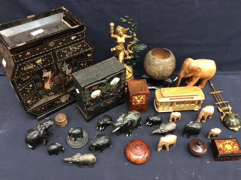 A collection of treen items, i.e. walnut pots, elephants, coconut pot ...