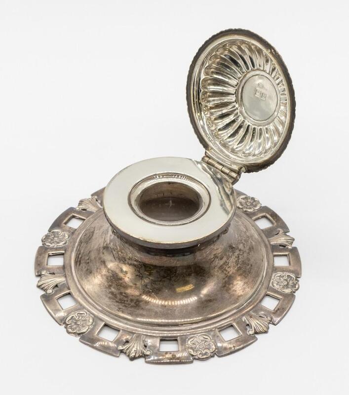 An early 20th century Edwardian silver capstan inkwell, having a ...