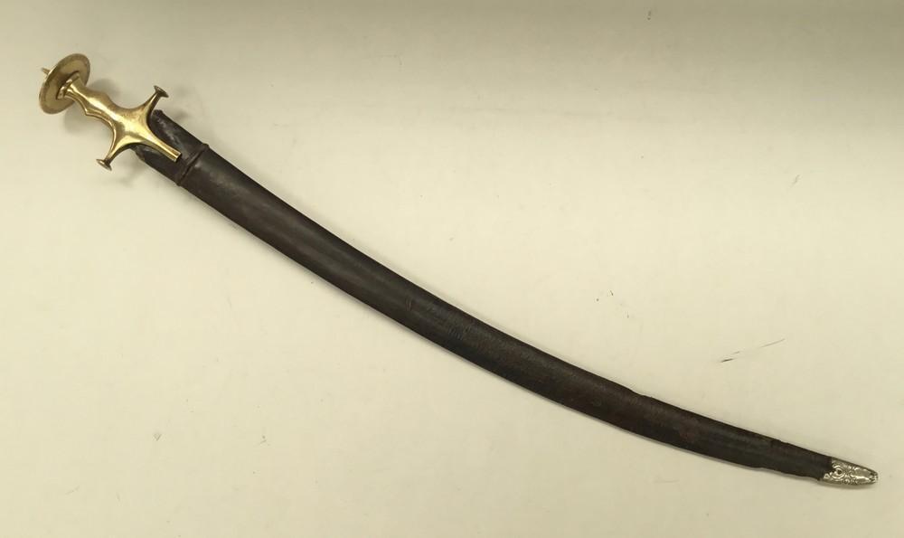A 19th century Indian talwar sword. Typical form, with brass handle ...