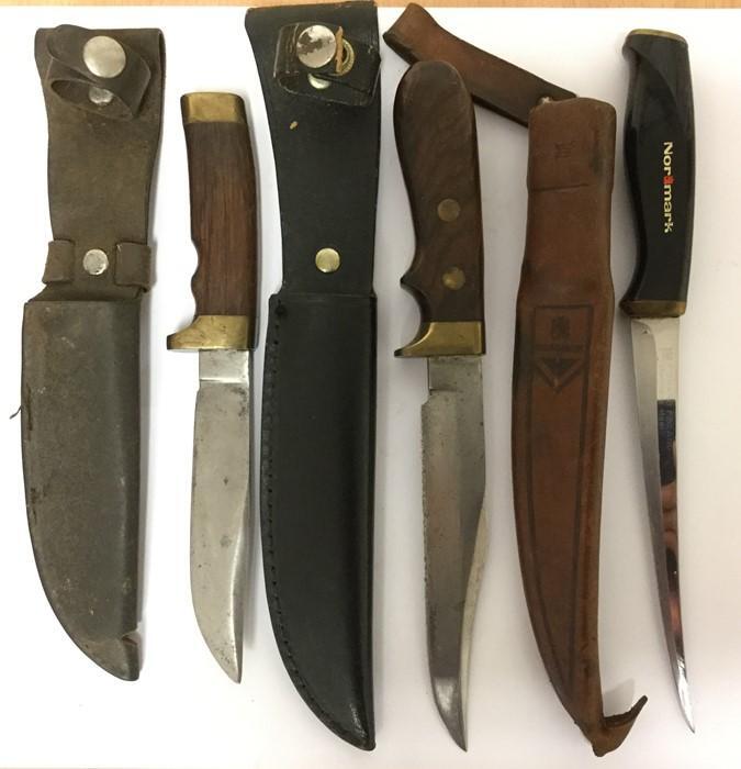A collection of three general purpose hunting knives: one Finnish knife ...