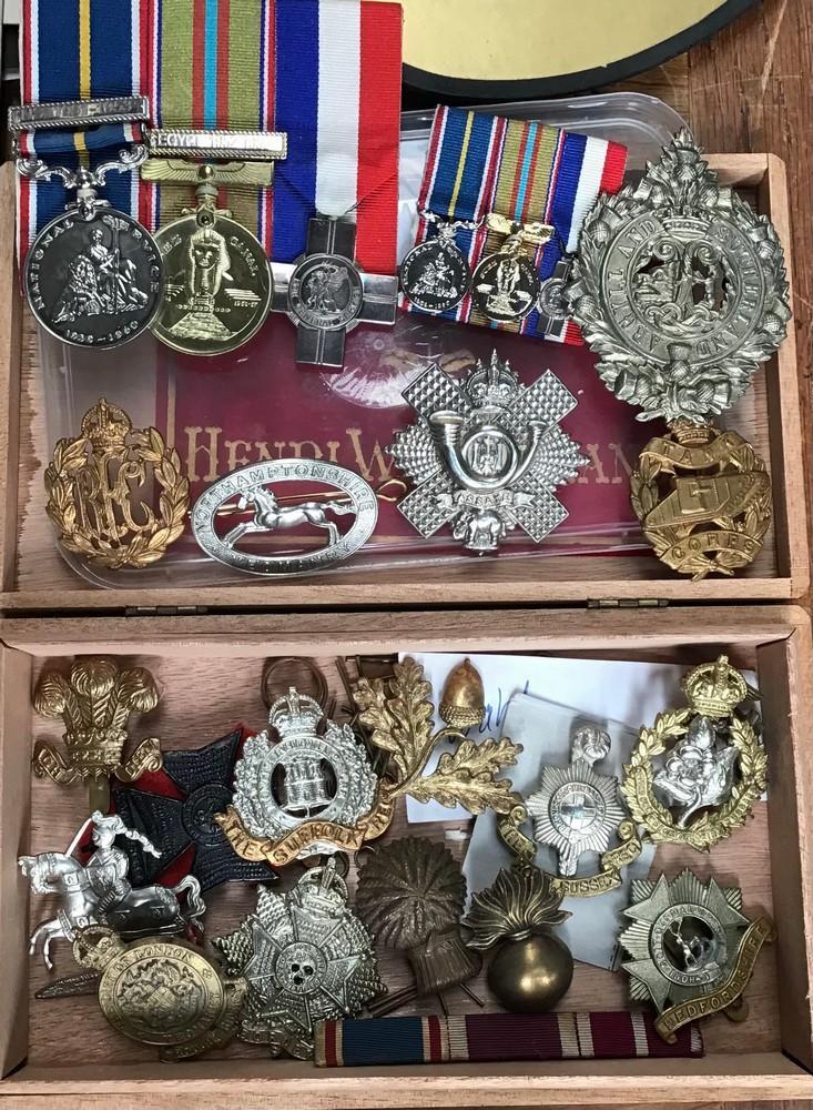 Large collection of military items, including cap badges, ribbon bars ...