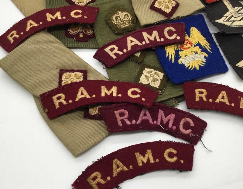 A large selection of WW2 and Post WW2 era R.A.M.C related metal badges ...