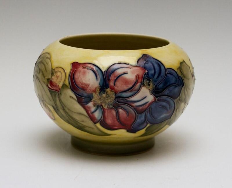 A Moorcroft clematis low vase, impressed mark, green W.M monogram and ...