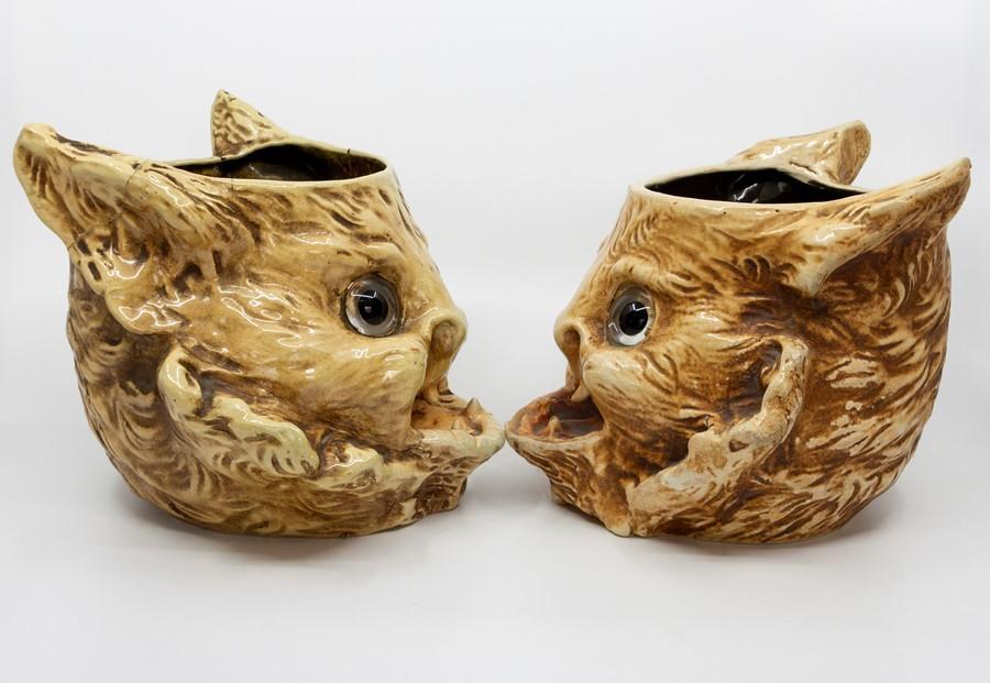 Two Bretby Art Pottery grotesque cat head night lights, with glass eyes ...