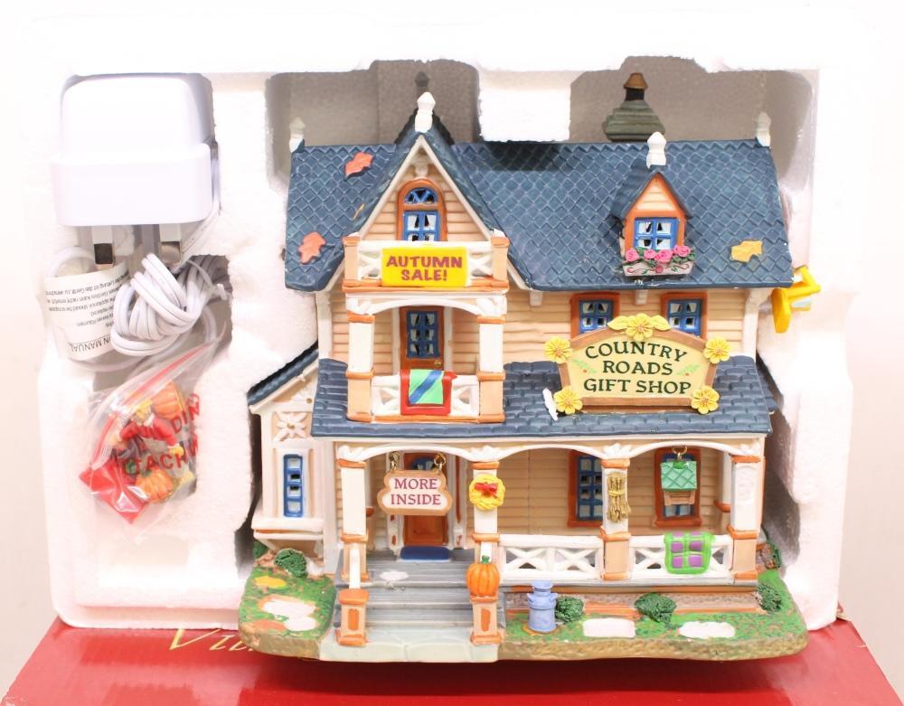 Lemax: A collection of three boxed Lemax: Village Collection items ...