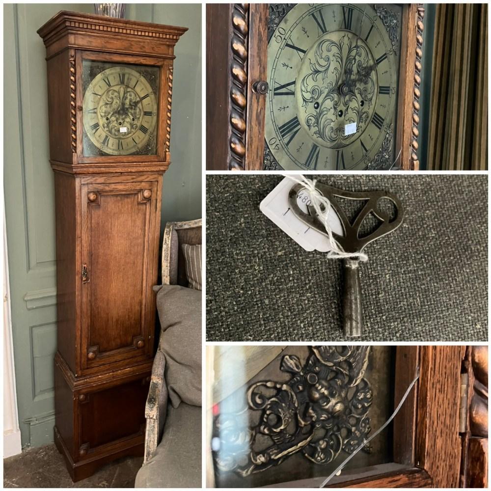 A reproduction longcase clock in an oak case with 3 train associated ...