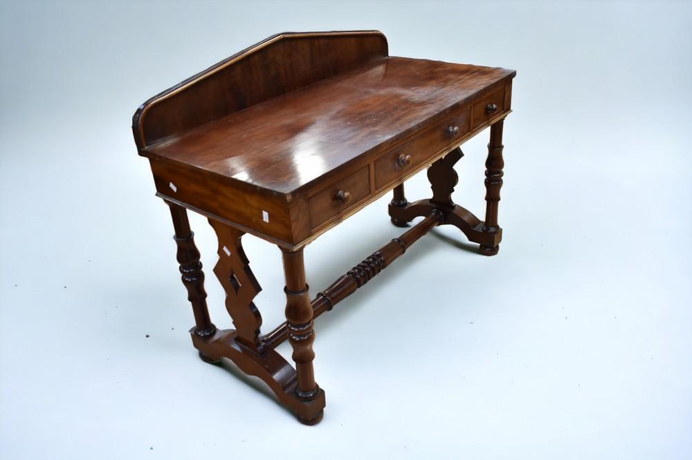 A Victorian mahogany writing desk with backboard, detail to the top ...