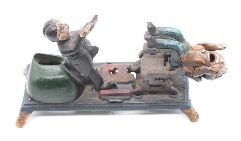 An early 20th century cast-iron novelty dentist mechanical money box ...