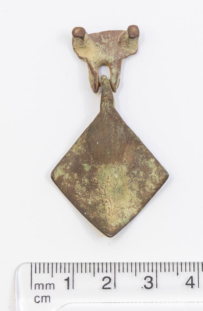 Medieval copper alloy lozenge Pendant and hanger depicting a blazing ...