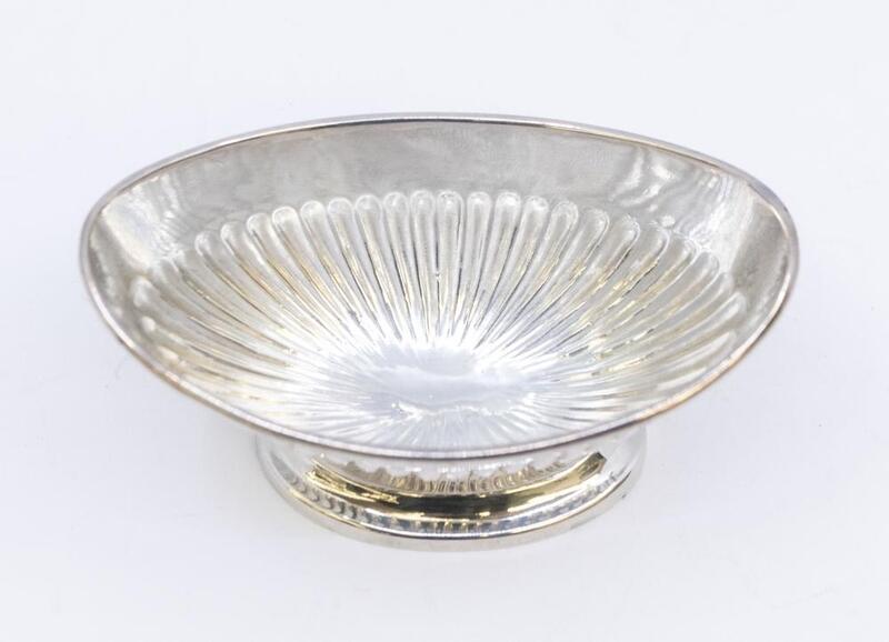 Four matching Victorian silver salt cellars, of curved oval form with ...