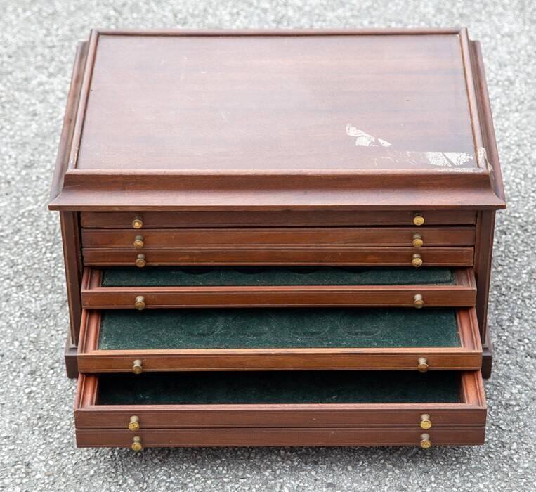 A reproduction mahogany coin collectors cabinet, late 20th Century, of ...