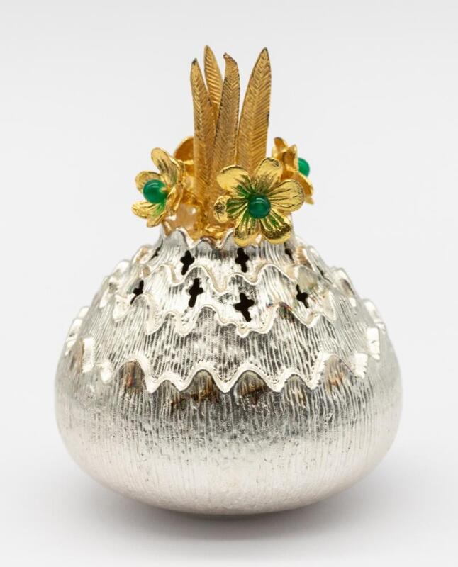 Christopher Nigel Lawrence - a textured silver floral shaped pomander, having silver coloured ...