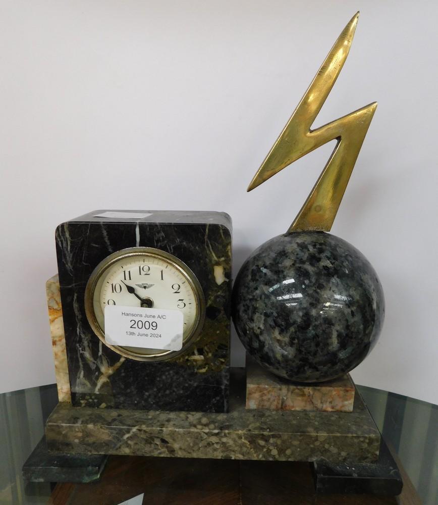 A 1930s Decco 8 day mantle clock with lightening bolt detail.