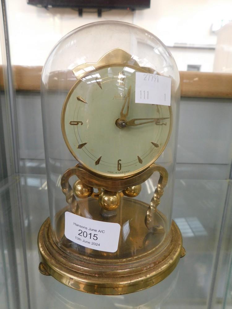 A 1950s anniversary clock in dome by Kundo.