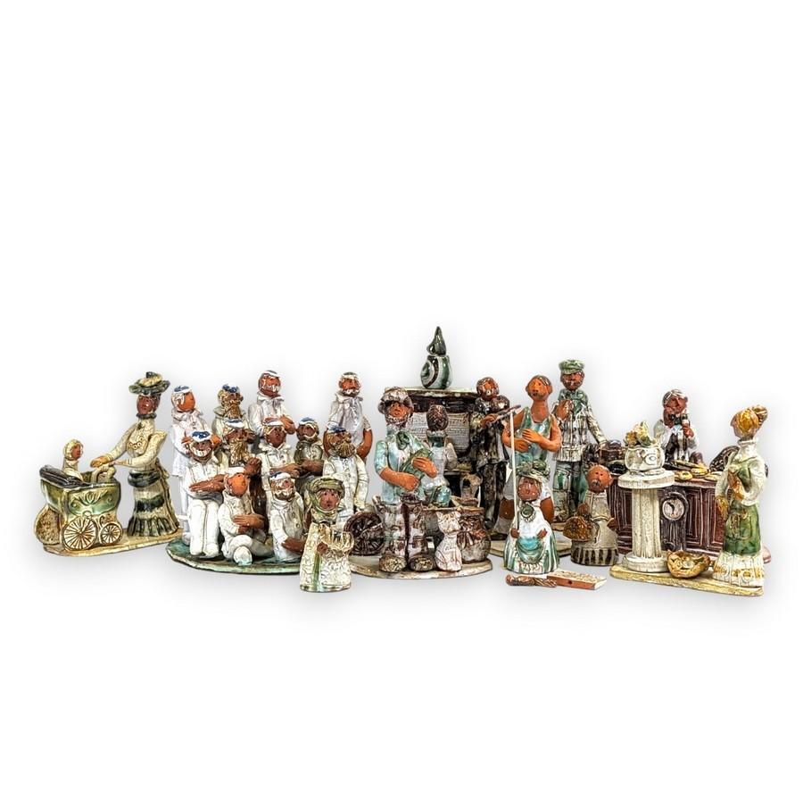 A collection of Marie Whitby Ashwell pottery figures. Eleven in total ...