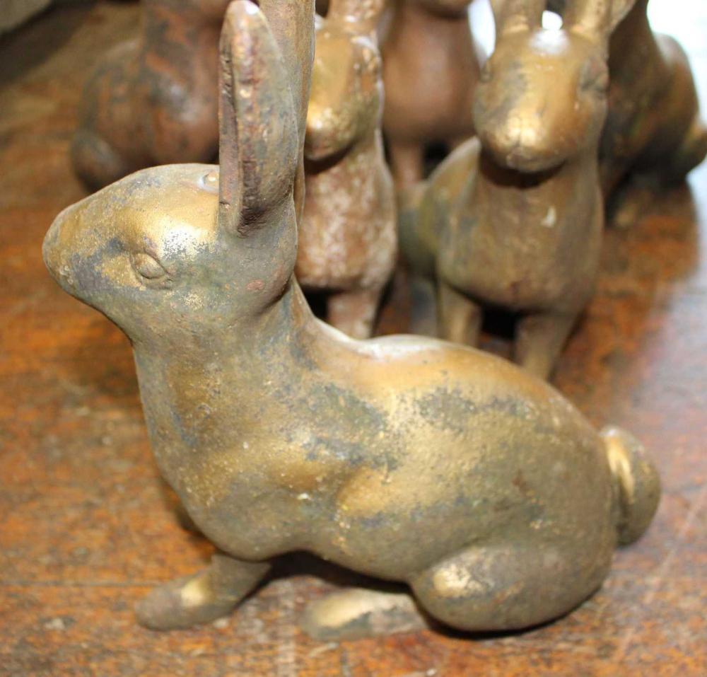 Set of 7 x identical cast iron bunny rabbits all show signs of peeling ...