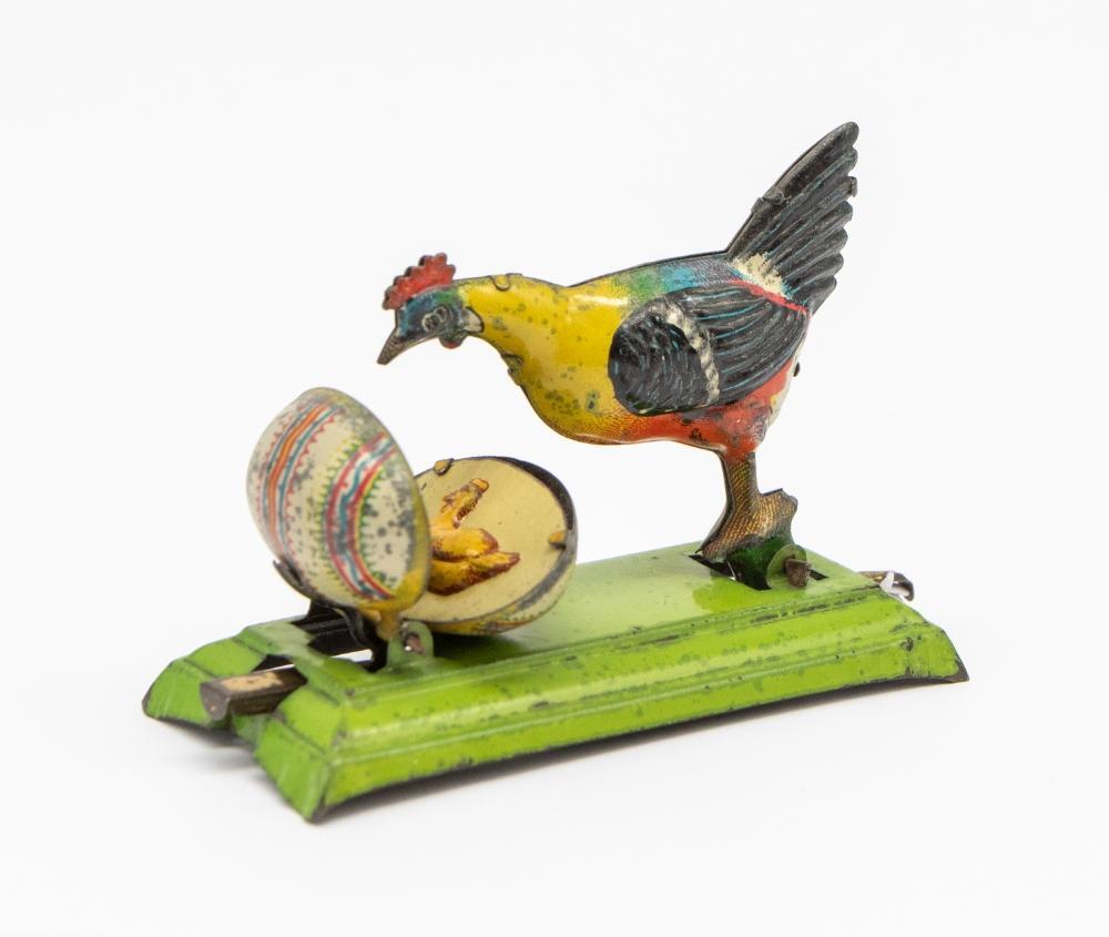 Tinplate: A rare early 20th century, lithographed tinplate penny toy ...
