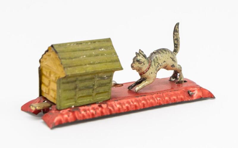 Meier: An early 20th century, lithographed tinplate penny toy dog in ...
