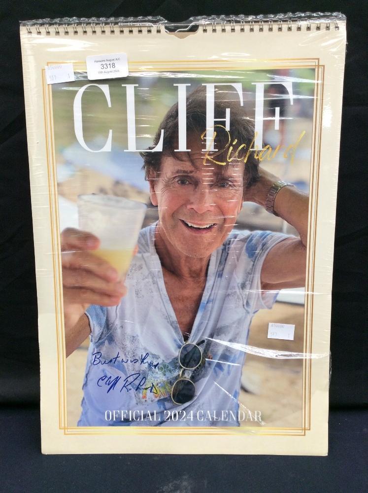 A signed 2024 Cliff Richard calendar.
