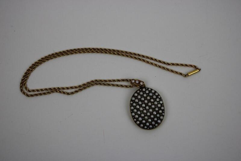 A Gold, Half-Pearl and Diamond Locket, circa 1870's, the oval hinged ...