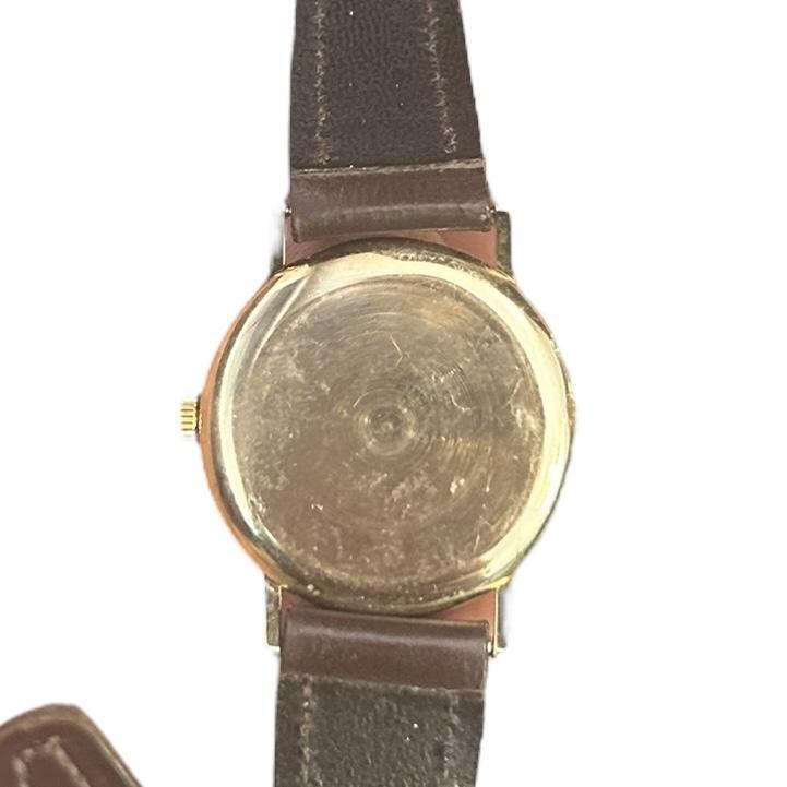 A c1960s Marvin automatic watch in unmarked 9ct gold casing with brown ...