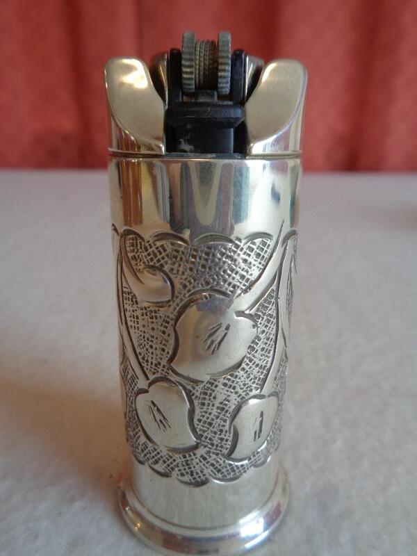 A white base metal lighter together with 2 glass cube shaped table ...
