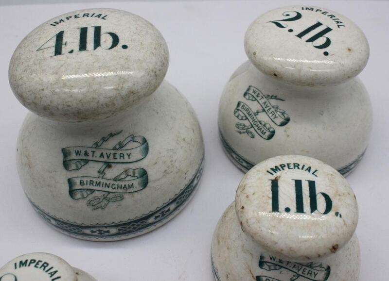 A set of six graduated ceramic imperial weights by W T Avery of ...
