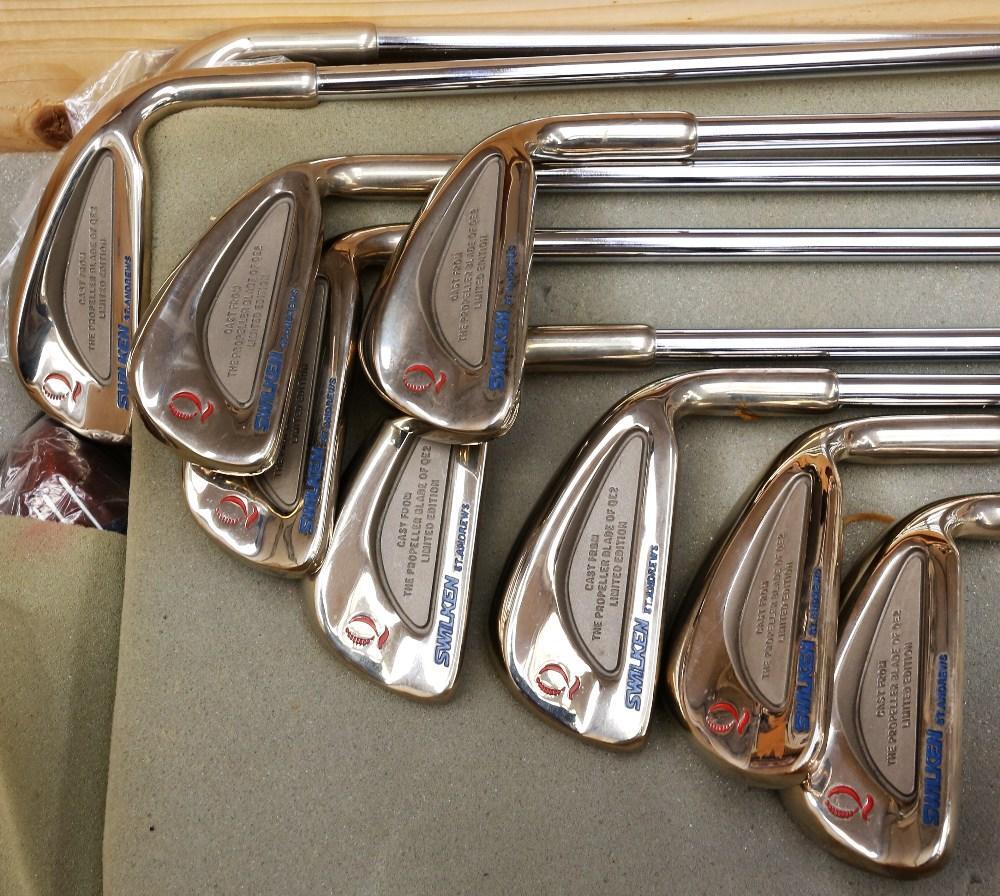 A set of golf clubs with wooden crate made with the propeller blade ...
