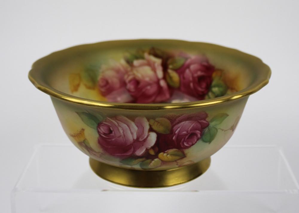 A Royal Worcester porcelain bowl painted with roses - puce printed ...