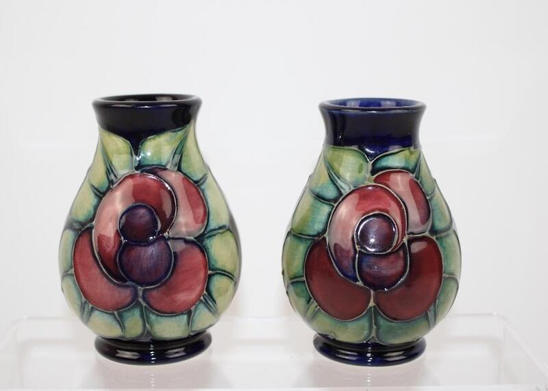 Moorcroft - Two small Moorcroft Rose pattern bulbous vases, designed by ...