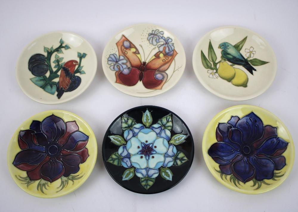 Moorcroft - Six small Moorcroft plates decorated with stylised flowers ...