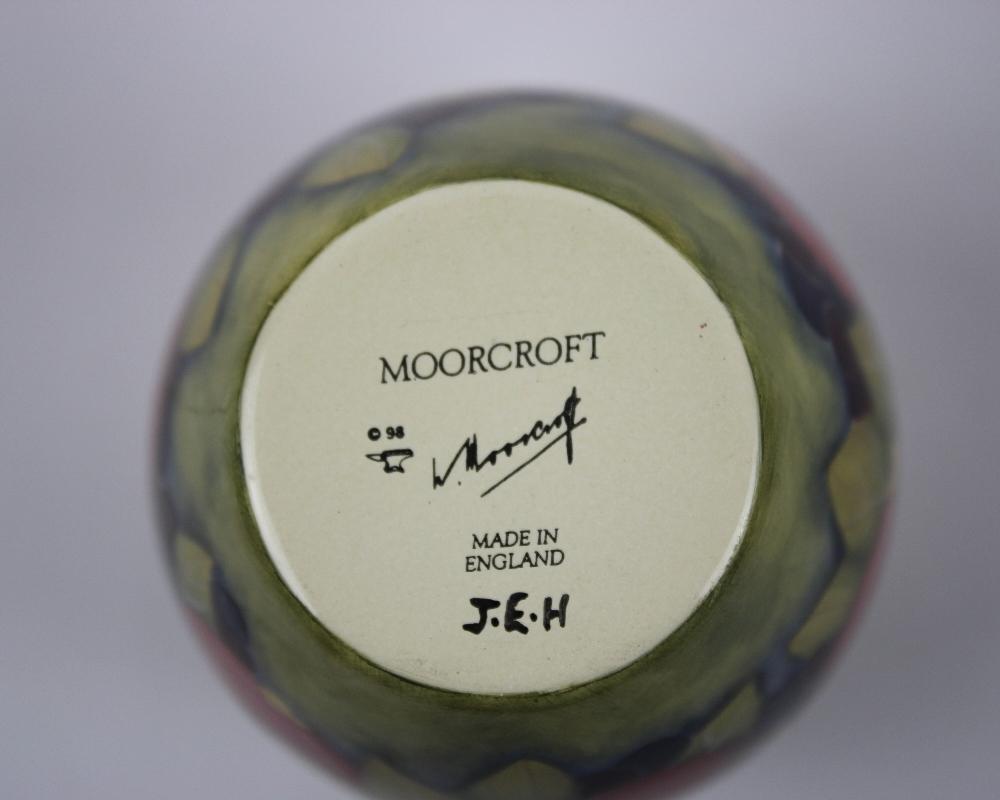 MOORCROFT ENAMEL comprising a Pomegranate Ginger Jar, factory marks to ...