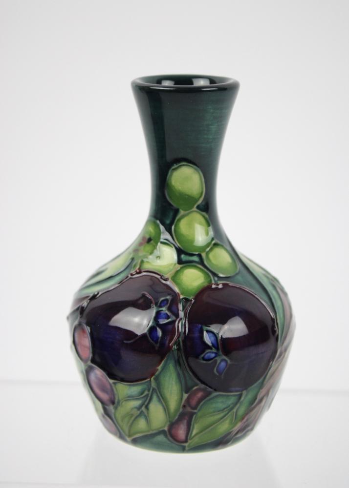 Moorcroft - A small Pomegranate pattern bud vase , factory impressed ...