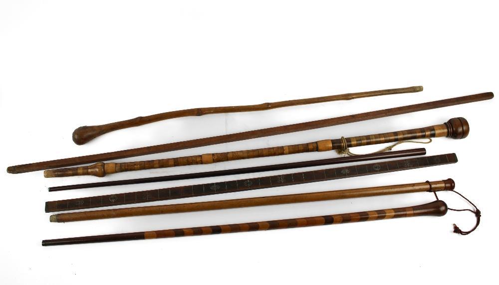 An early 20th century coopered oak barrel shaped oval stick stand, with ...