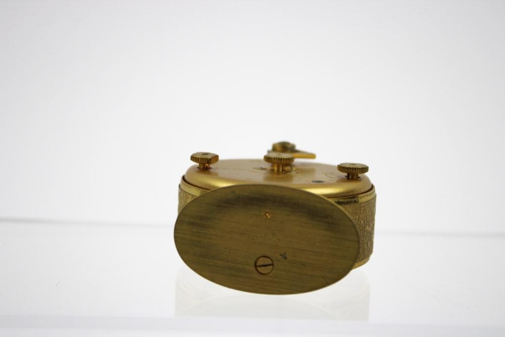 A Jaeger-Le-Coultre miniature eight day travel alarm clock , having a ...