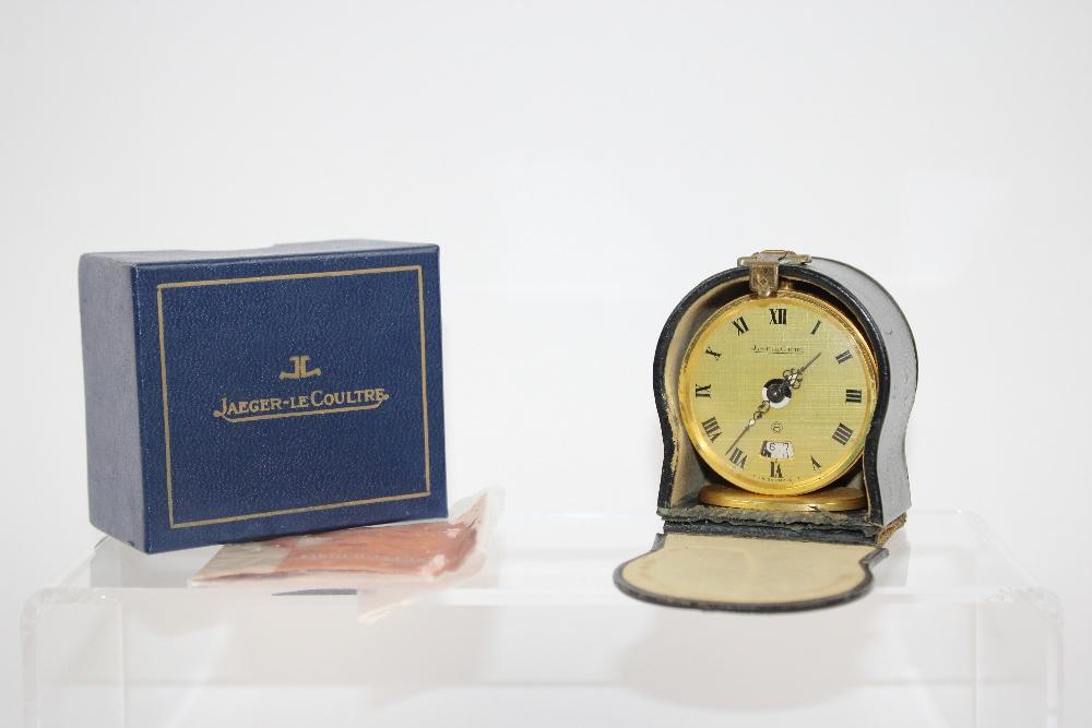 A Jaeger-Le-Coultre miniature eight day travel alarm clock , having a ...