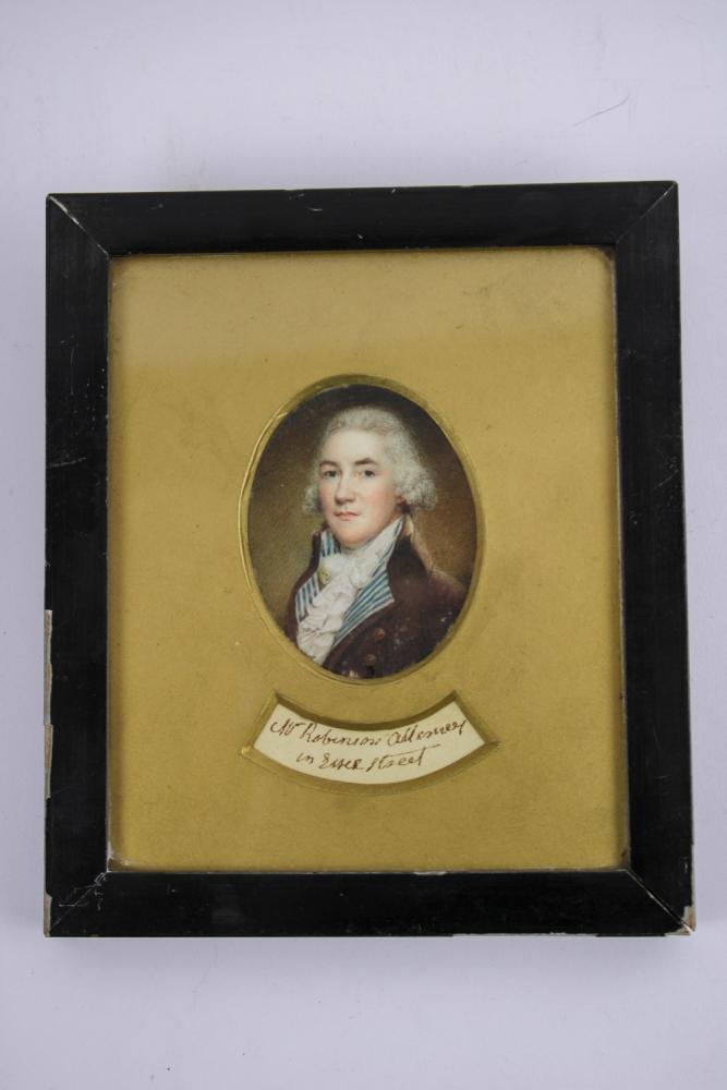 A pair of early 19th Century miniatures on ivory, of noblemen , mounted ...
