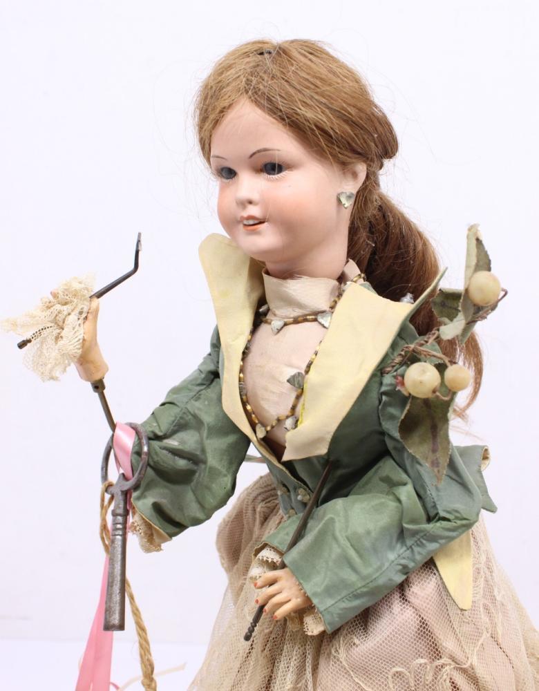 Automaton: An early 20th century, bisque head automaton doll, fixed ...