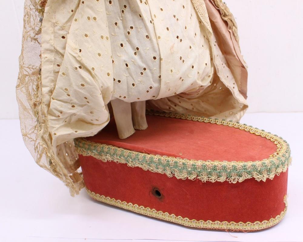 Automaton: An early 20th century, bisque head automaton doll, fixed ...